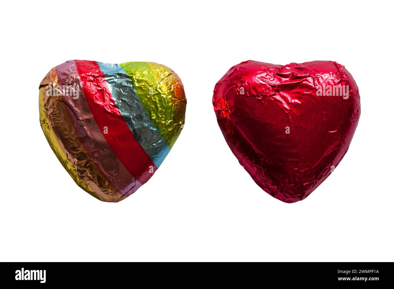 two 2 foil wrapped heart shaped chocolates, one red foil, one multi ...