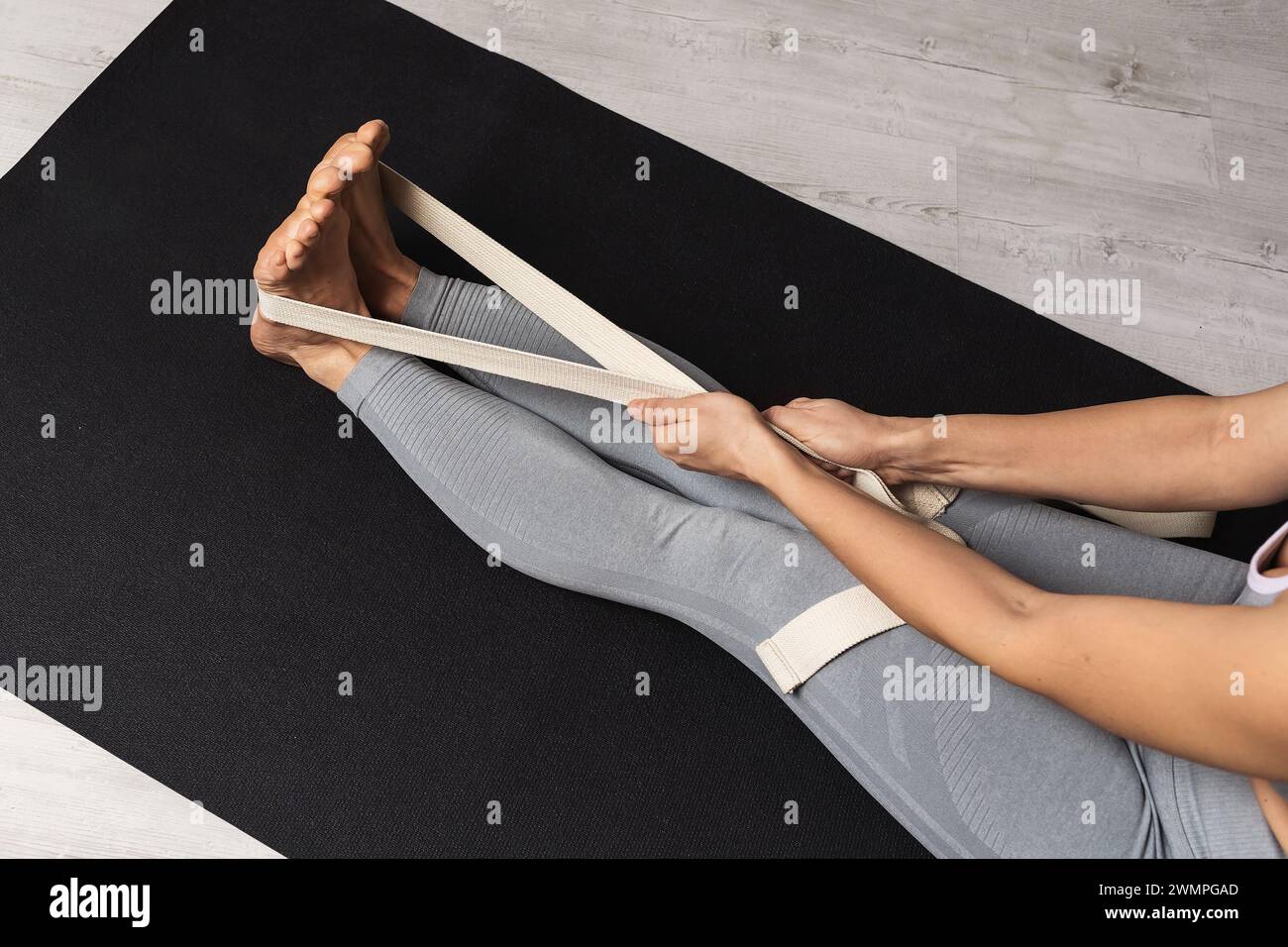 Woman working out straps hi-res stock photography and images - Alamy