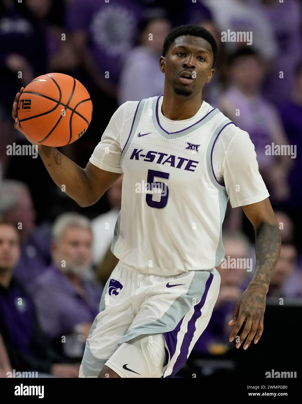 Kansas State guard Cam Carter drives during the second half of an NCAA ...
