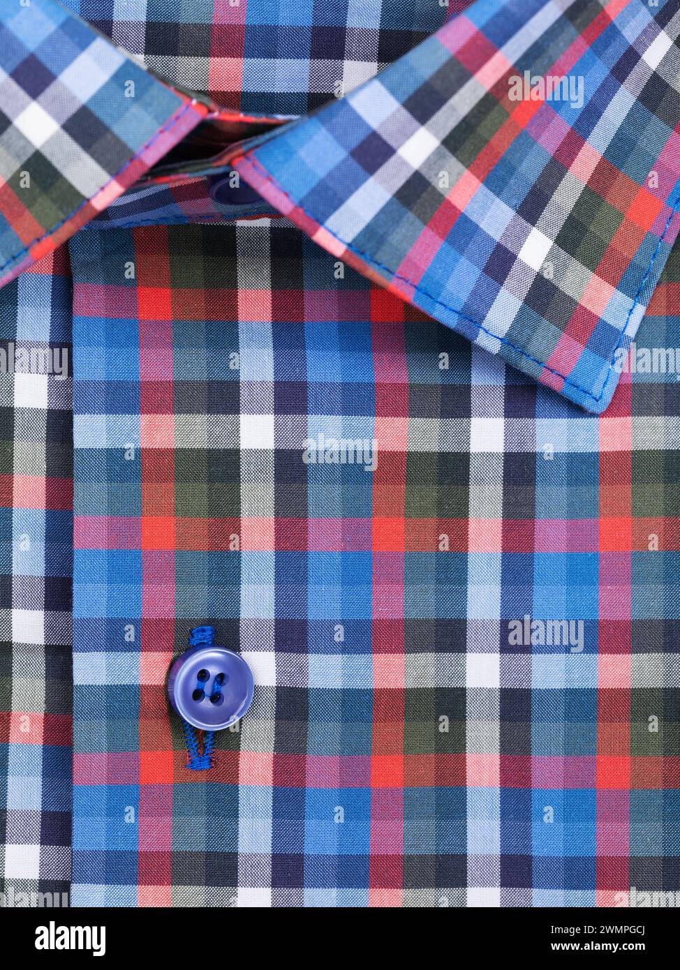 Close-up of a button placket on a multi-colored plaid men's shirt Stock ...