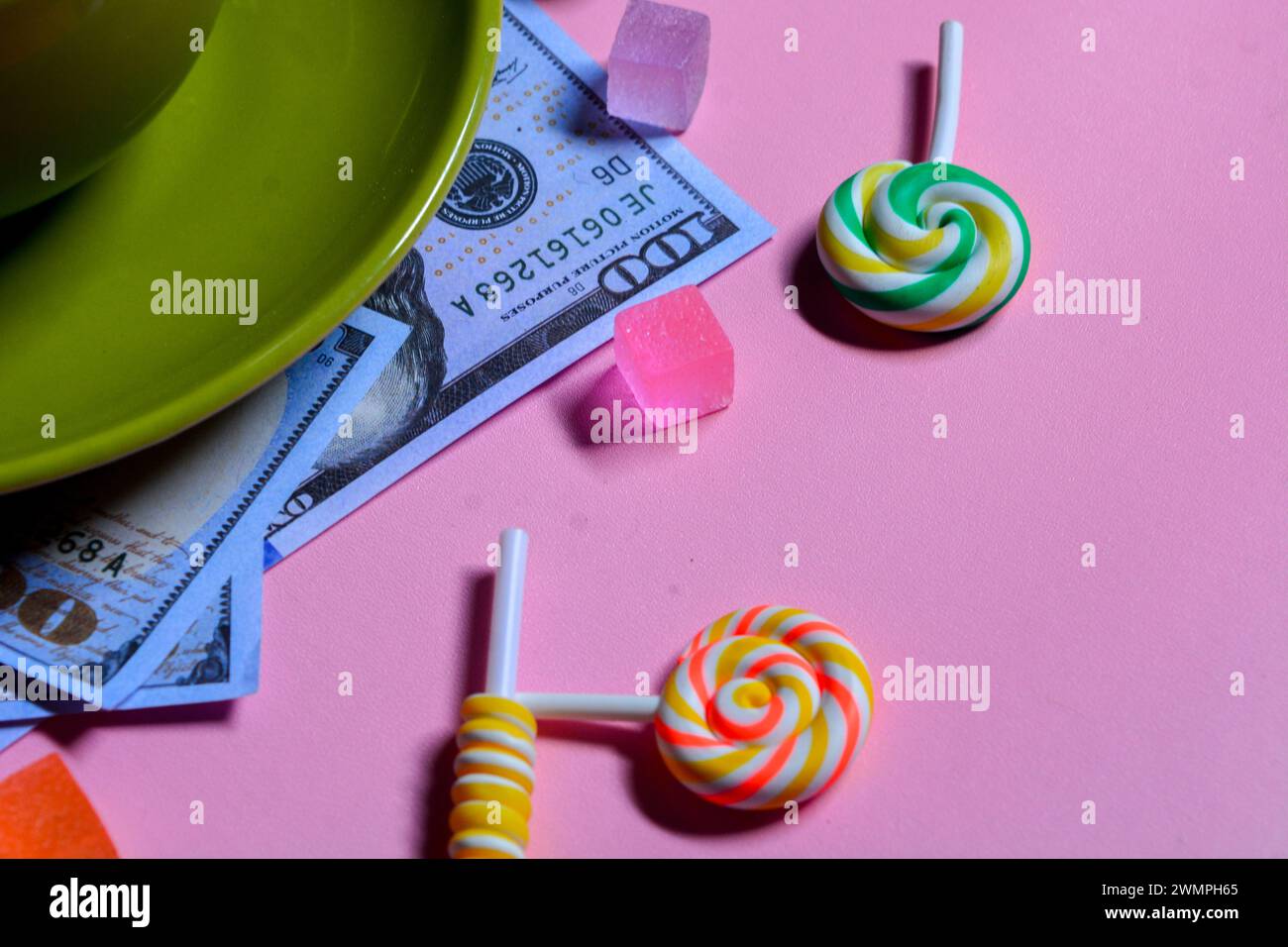Little candies on a pink background Stock Photo - Alamy