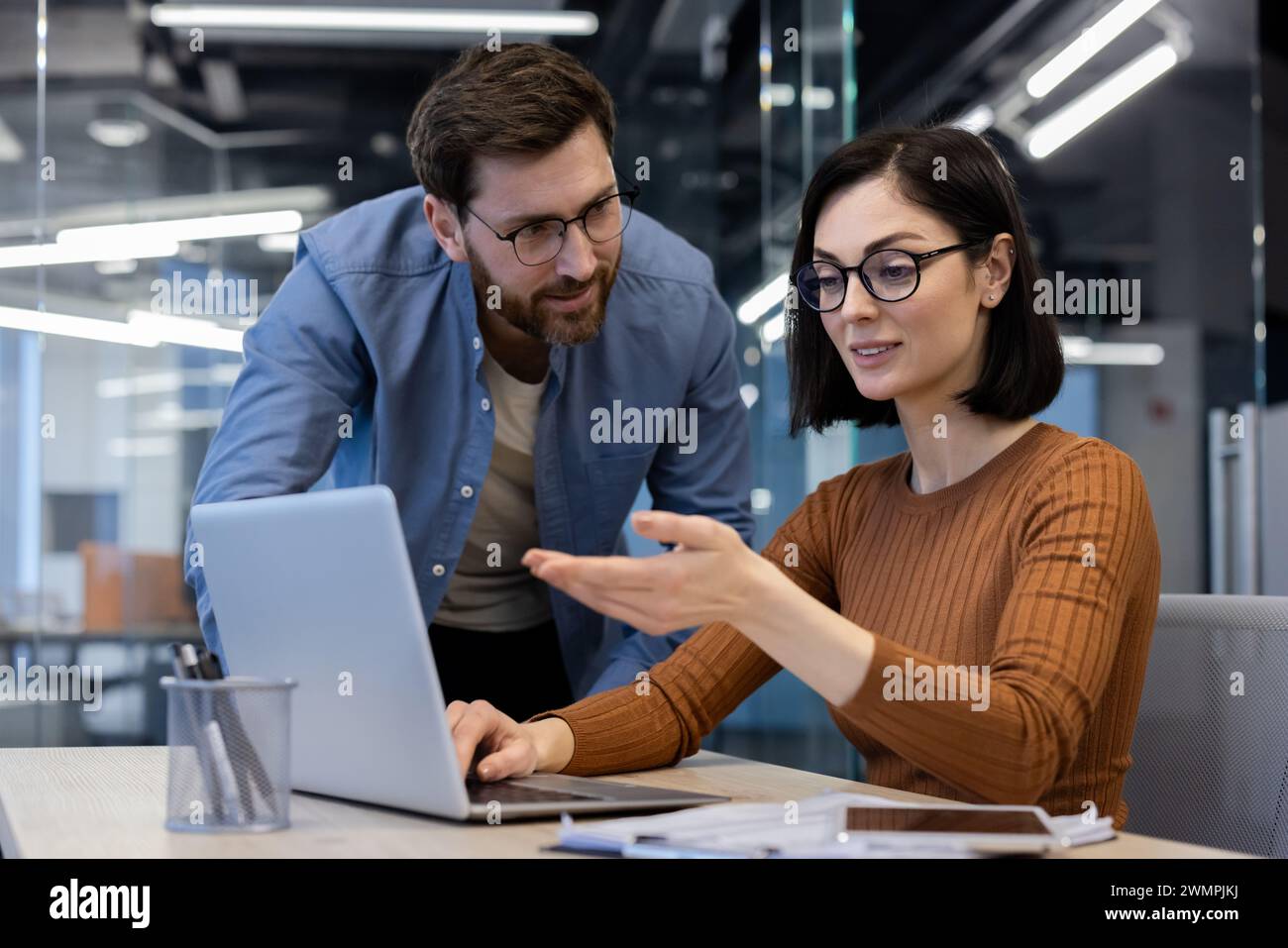 Female secretary explaining boss in hi-res stock photography and images ...