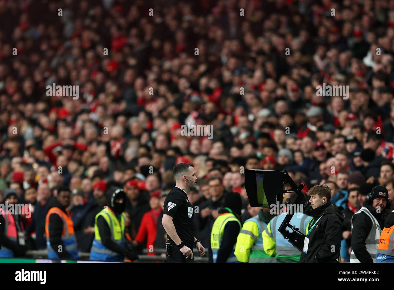 London, UK. 25th Feb, 2024. Referee Chris Kavanagh checks VAR monitor ...