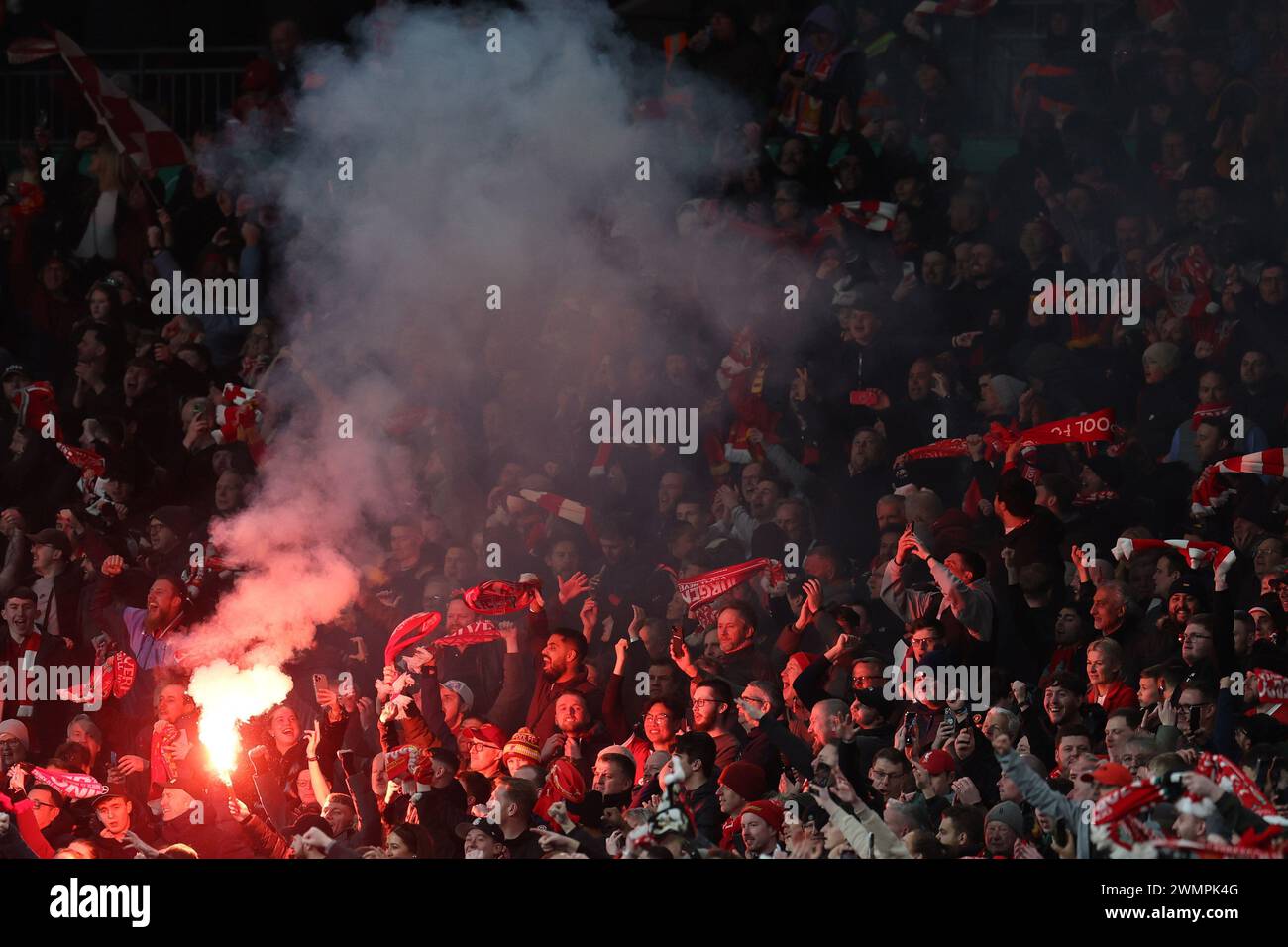London, UK. 25th Feb, 2024. Liverpool fans with flares celebrate after ...