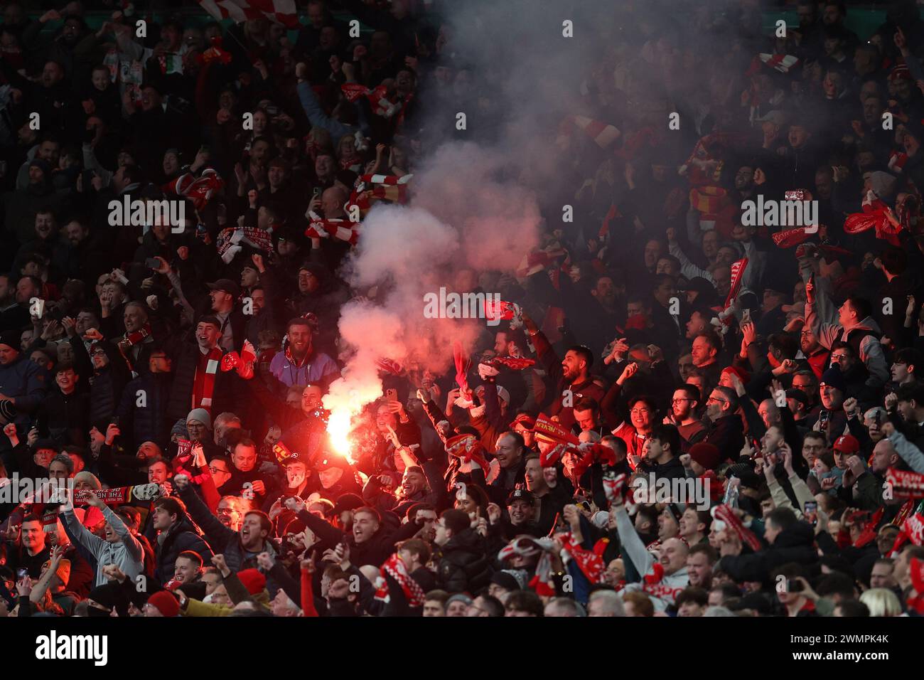 London, UK. 25th Feb, 2024. Liverpool fans with flares celebrate after ...