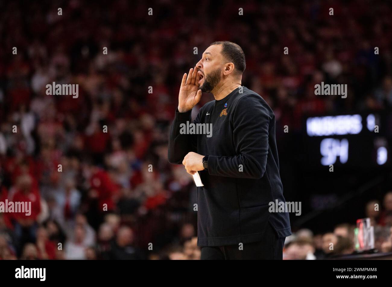 Minnesota head coach Ben Johnson yells to his team as they play against ...