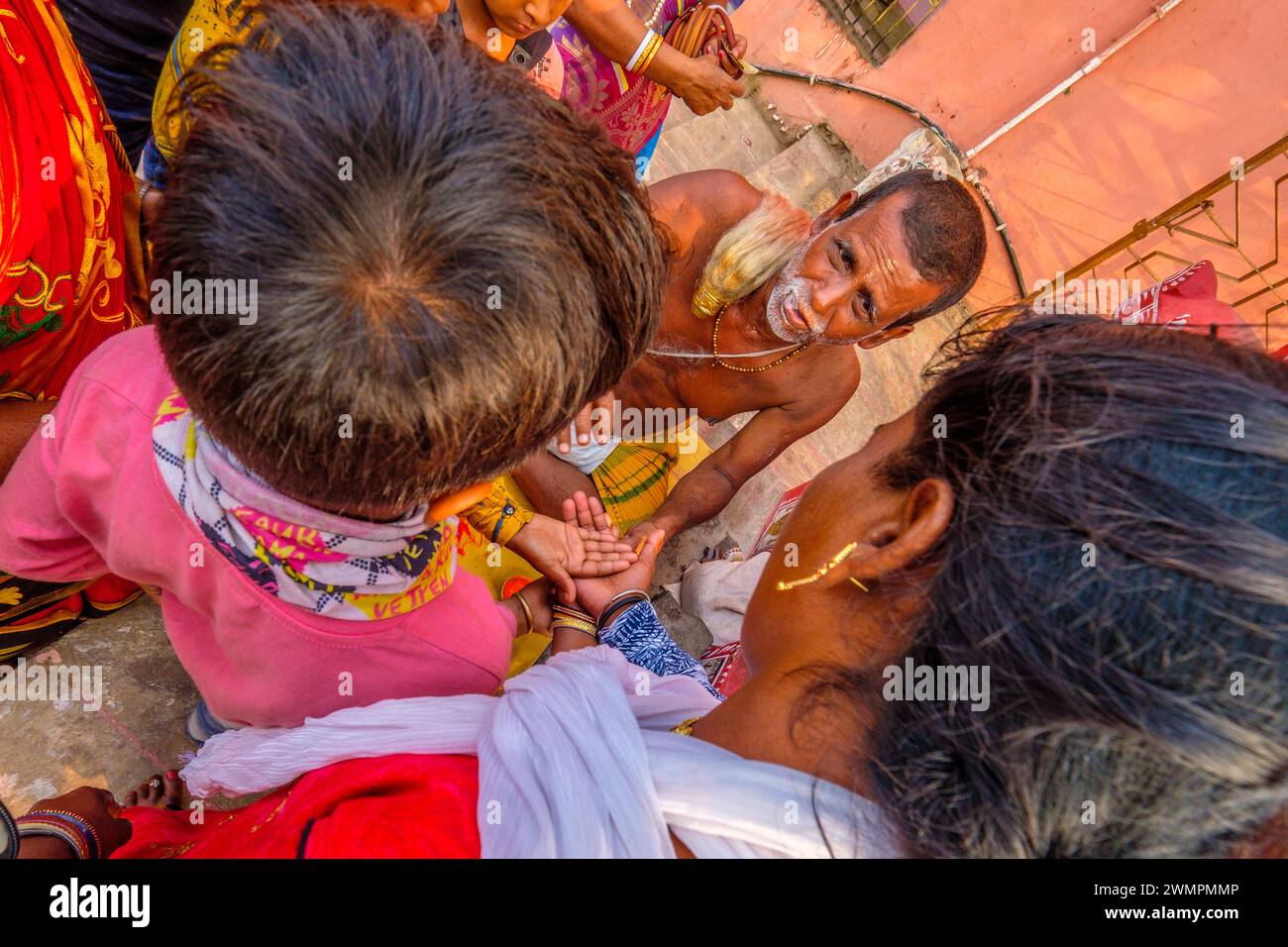 An Indian priest dispensing blessings at a temple in Puri, India Stock ...