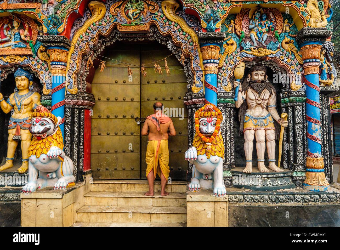 Devotee outside a Hindu temples in Puri in the Indian state of Orissa ...