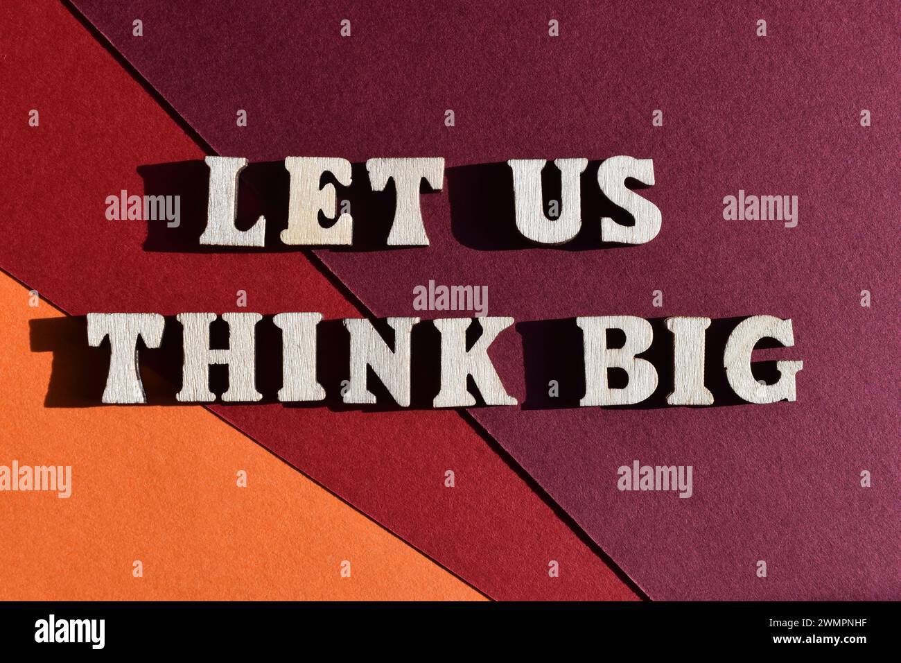 Let Us Think Big, words in wooden alphabet letters isolated on ...