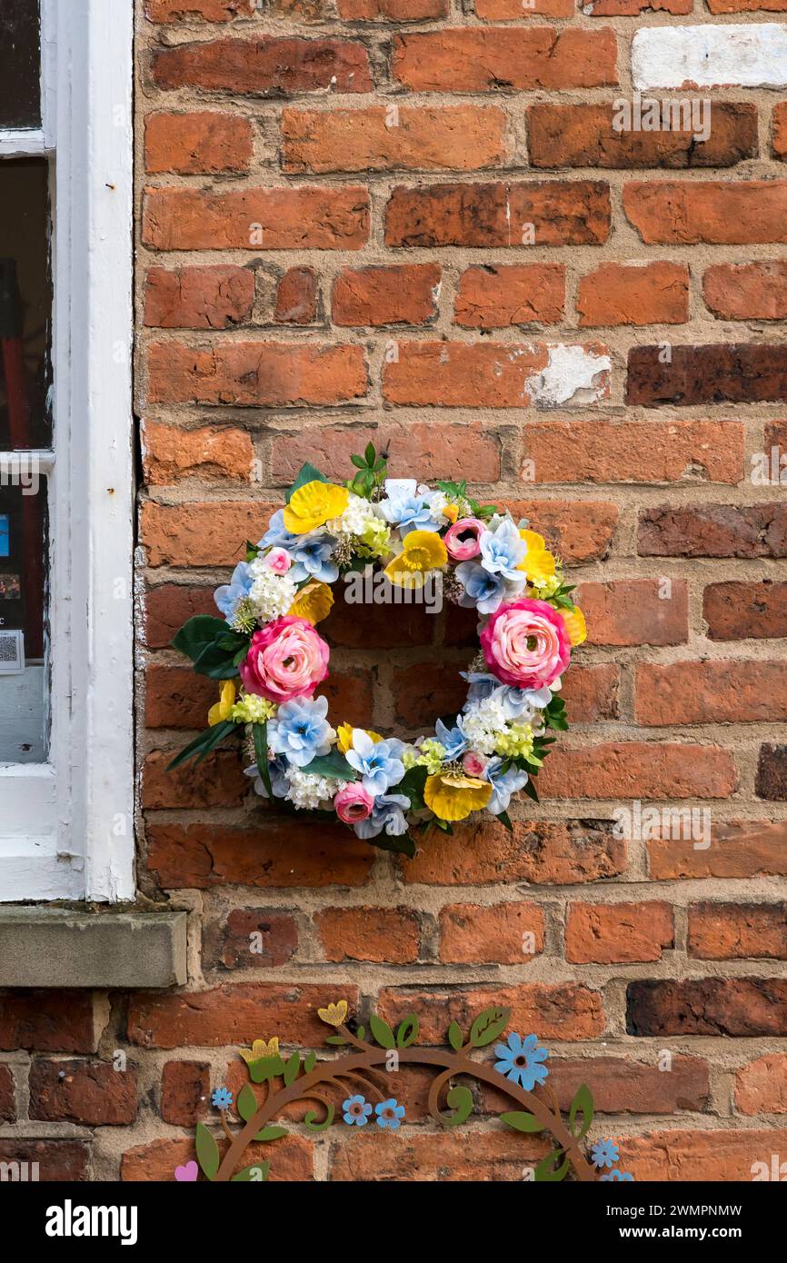Colourful wreath on wall of florist shop, Steep Hill, Lincoln City ...