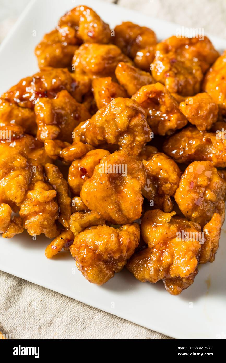 Deep Fried Asian Orange Chicken with Chopsticks Stock Photo - Alamy