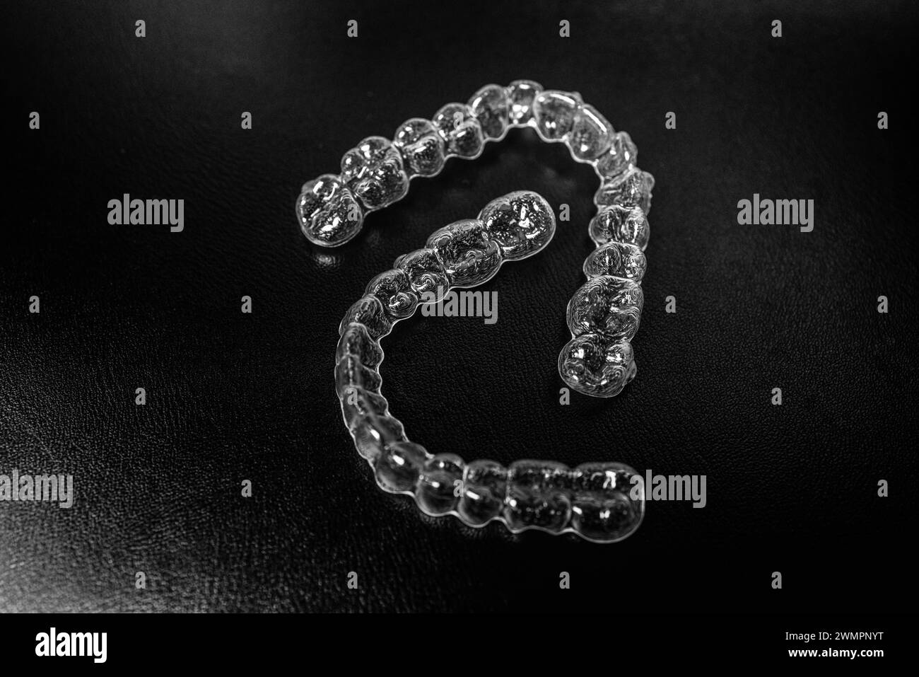 Invisible dental teeth brackets tooth aligners on black background ...