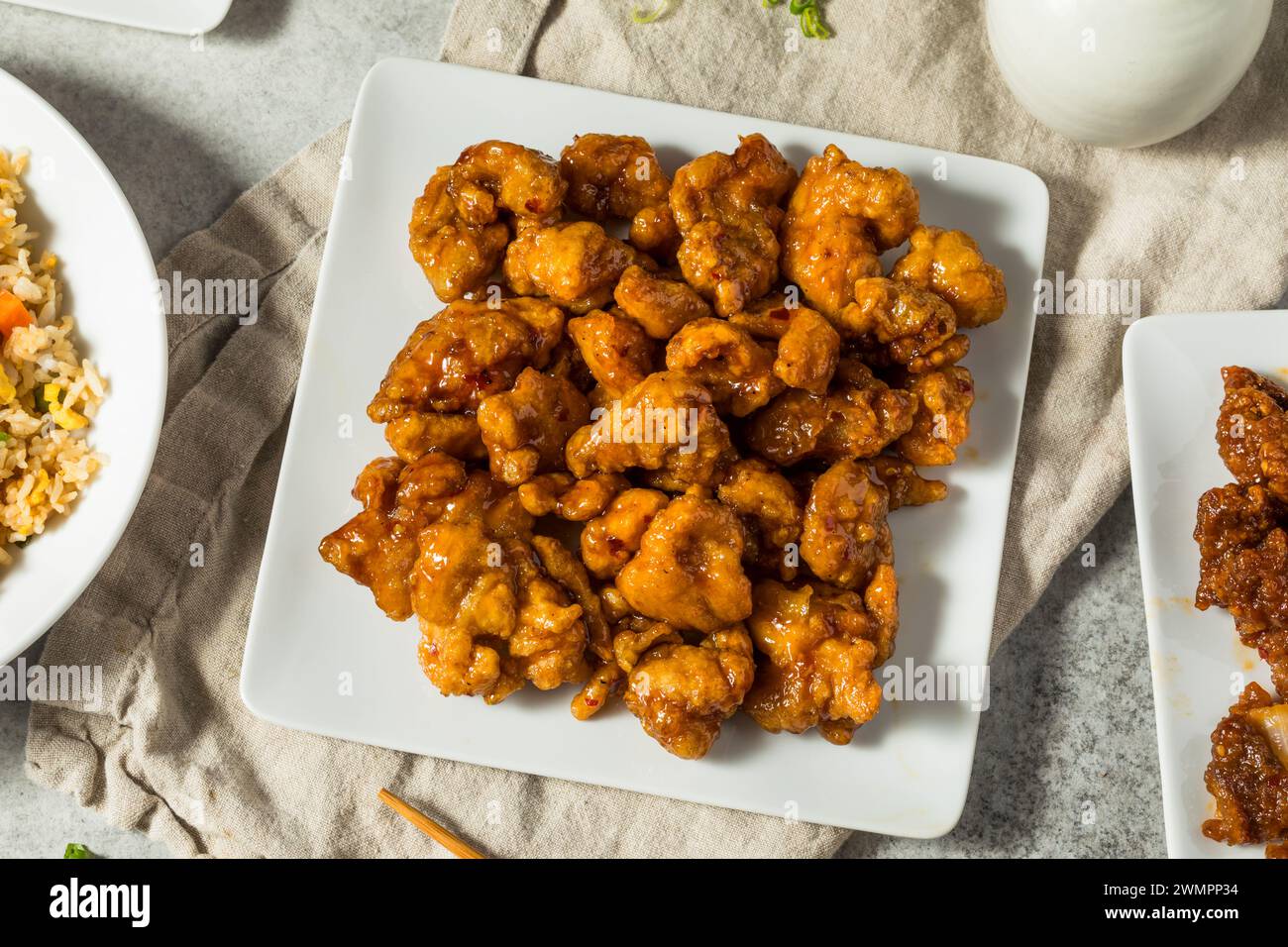 Deep Fried Asian Orange Chicken with Chopsticks Stock Photo - Alamy