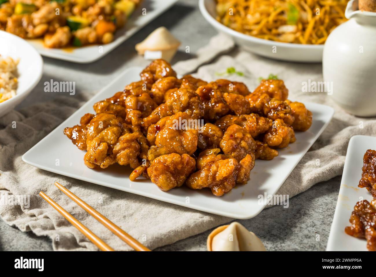 Deep Fried Asian Orange Chicken with Chopsticks Stock Photo - Alamy