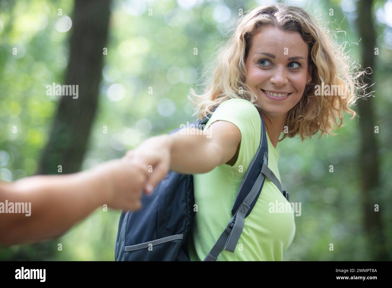 Young woman leading boyfriend on hi-res stock photography and images ...