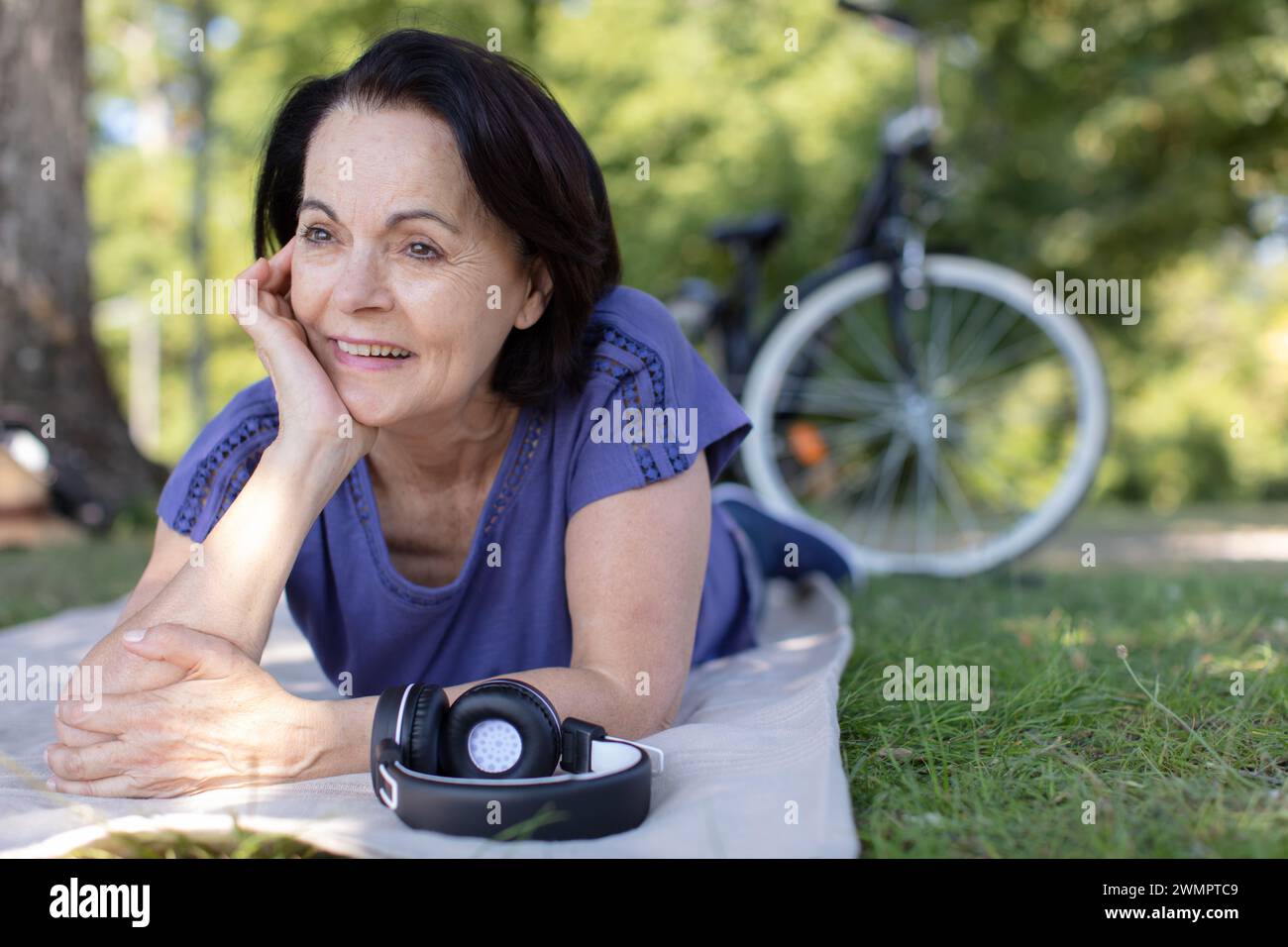 happy positive old lady relaxing in park Stock Photo - Alamy