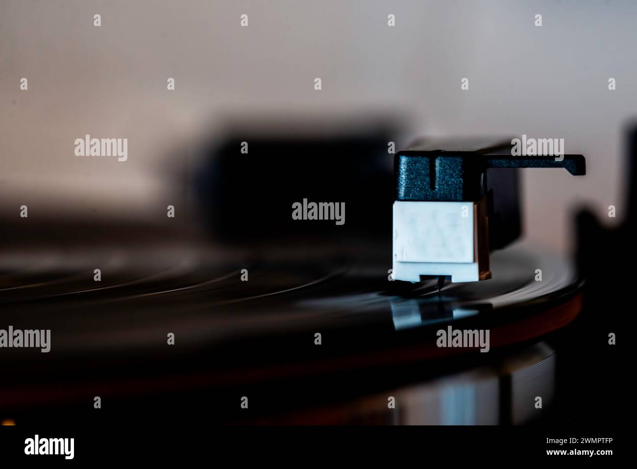 Vinyl player spinning a record with stylus on turntable Stock Photo - Alamy