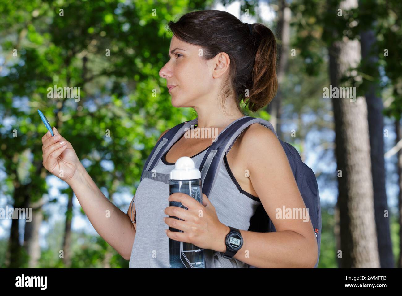 Woman reading compass map hi-res stock photography and images - Alamy