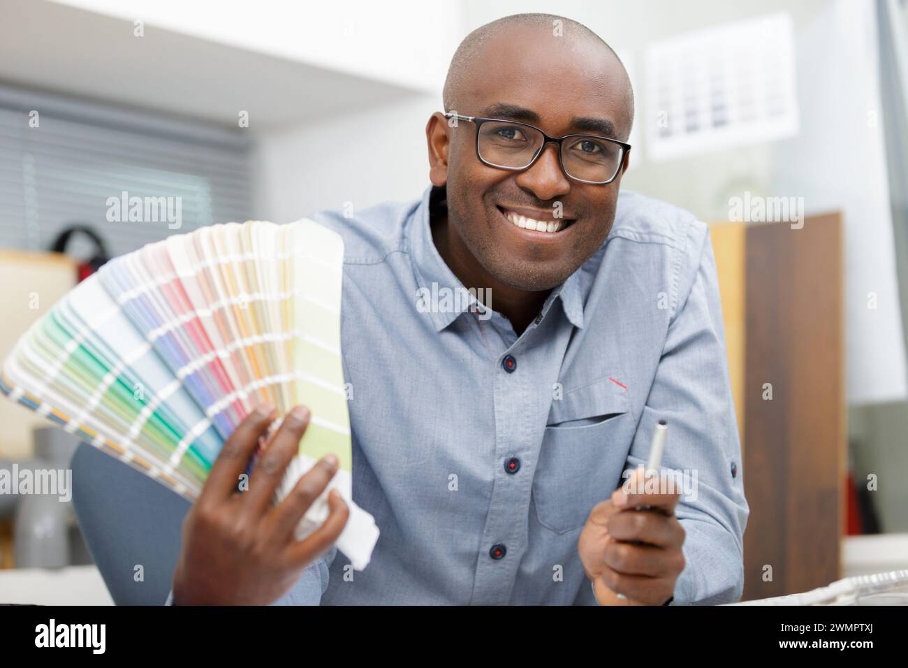 professional worker showing a set of color swatches Stock Photo - Alamy