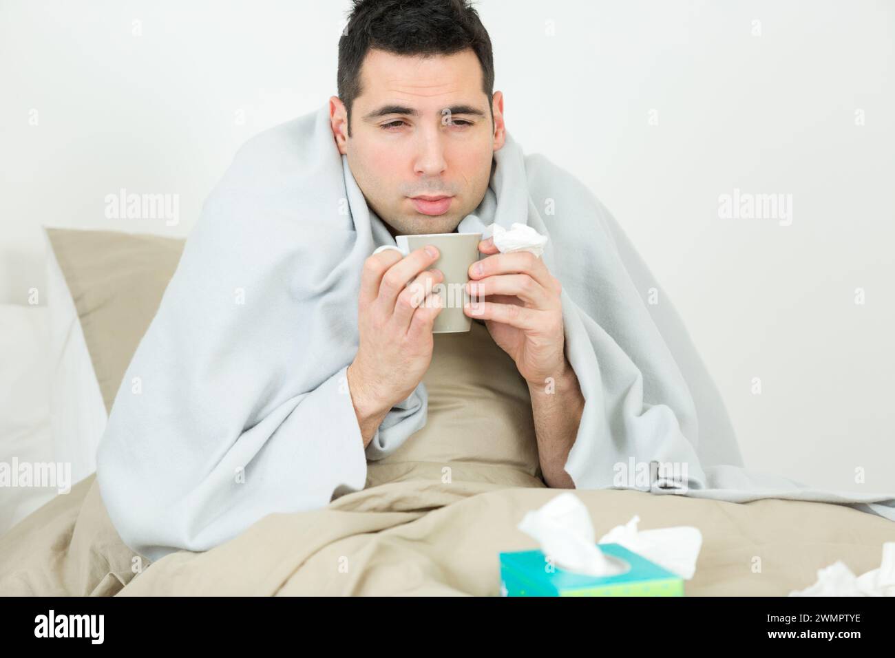 Sick man lies in bed hi-res stock photography and images - Alamy