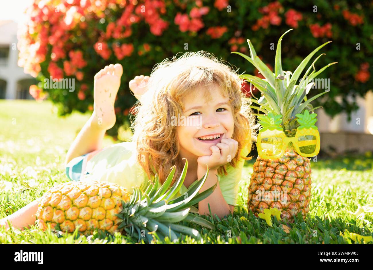 Pineapple kid boy and pineapples on summer vacation Stock Photo - Alamy