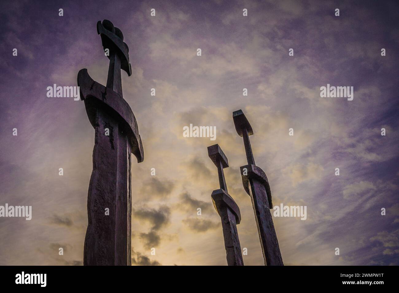 Statues at sunset along a walkway Stock Photo - Alamy