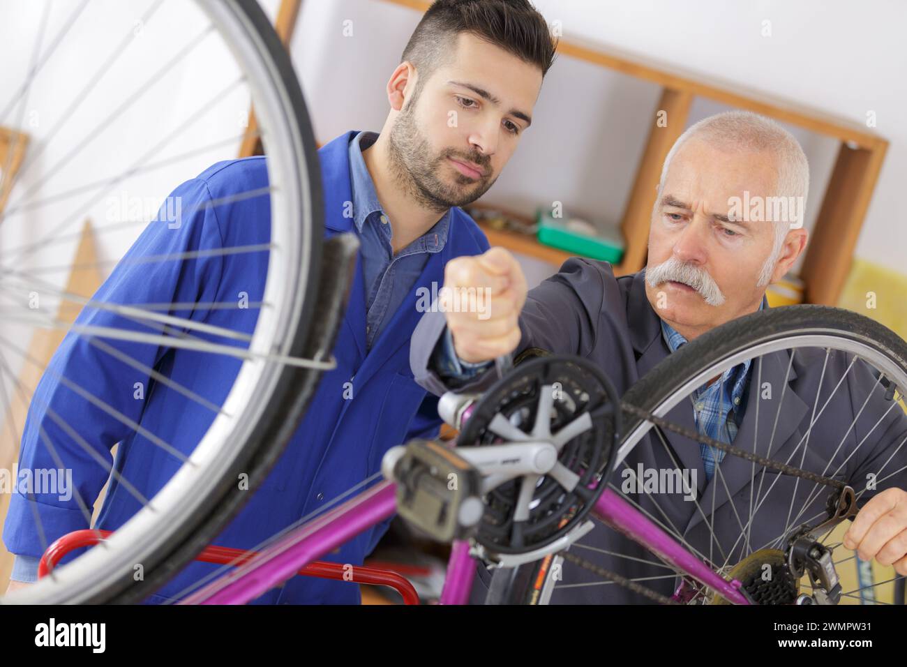 showing how to repair a bike Stock Photo - Alamy