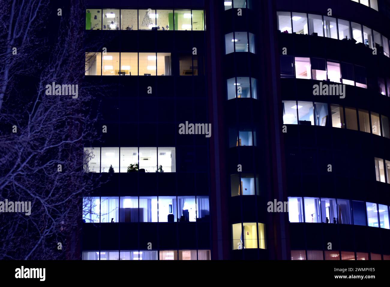 The picture shows a multi-storey building in which windows on different ...