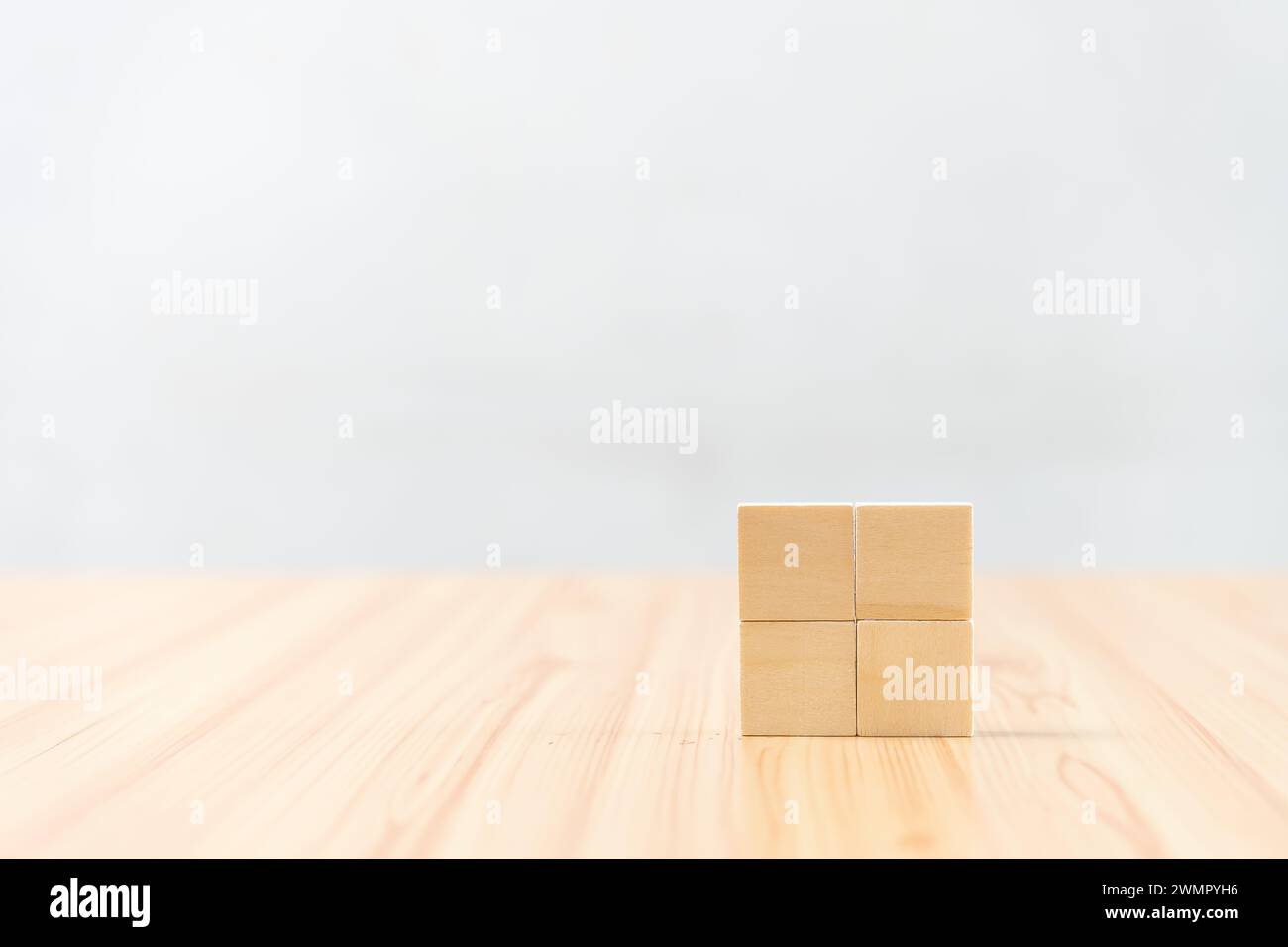 Cubes stacked on a table in geometric arrangement Stock Photo - Alamy