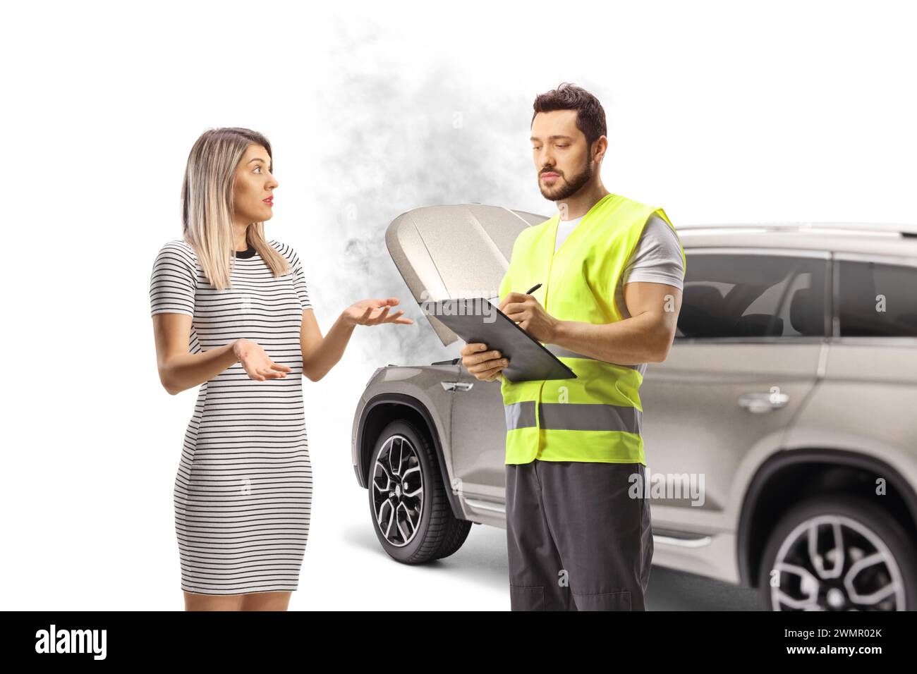 Road assistance worker and a young woman talking next to a broken SUV ...