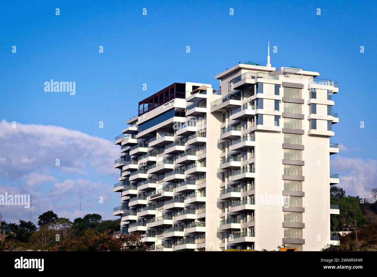 Image of tall buildings under construction with blue sky background in ...