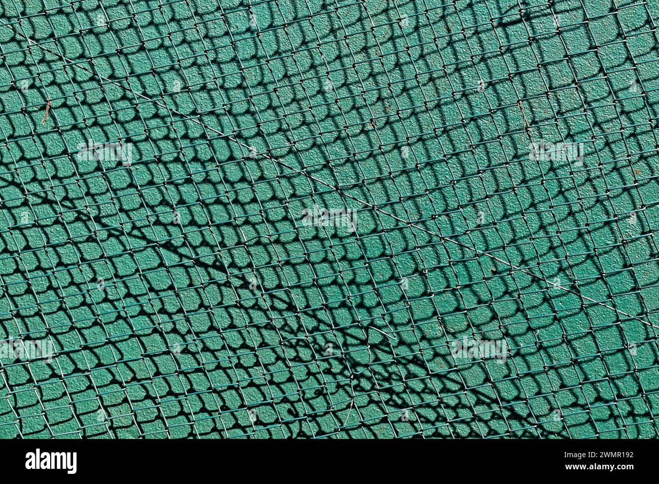 Green mesh, rhombus grid on green background Stock Photo - Alamy