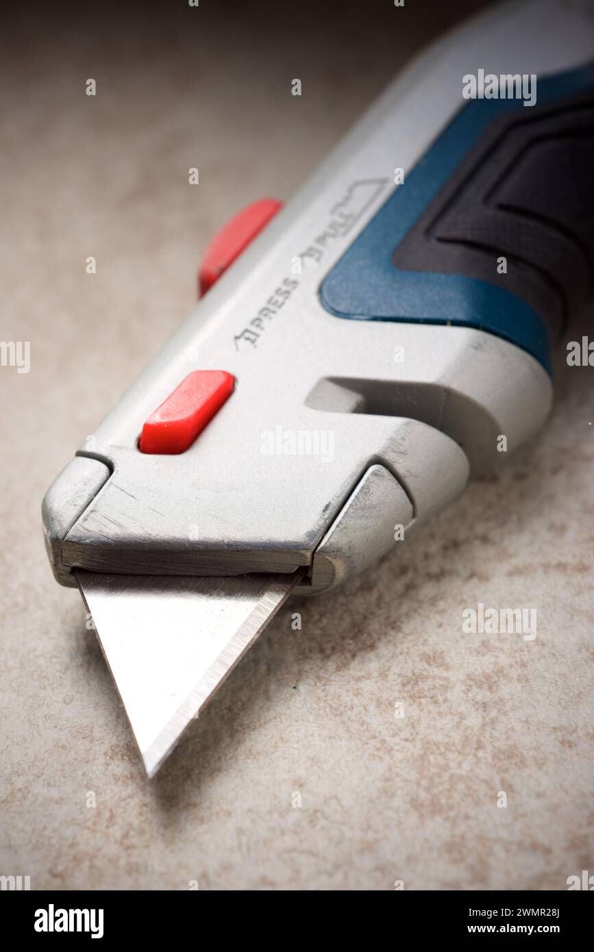Close up between shadows of a cutter on a work bench Stock Photo - Alamy