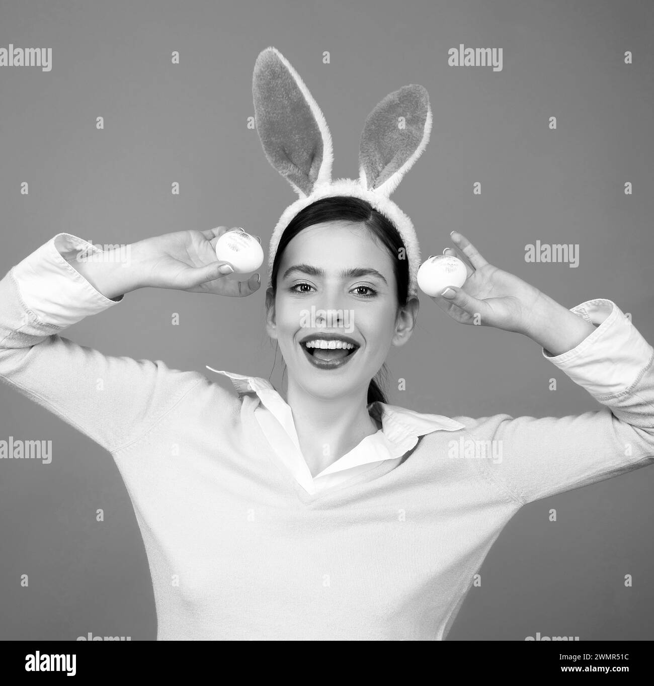 Easter bunny rabbit girl with egg. Female woman in rabbit ears. Holiday ...