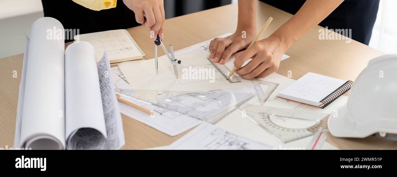 Professional architect team used divider measure during draft blueprint ...