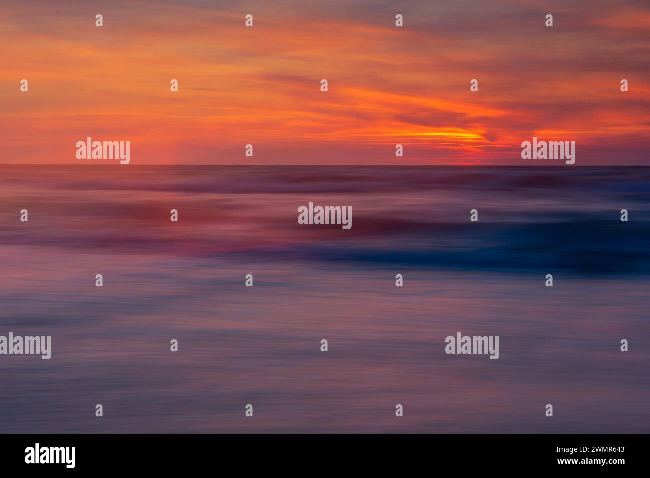 completely blurred sea water meets the horizon, sky and water colorful ...