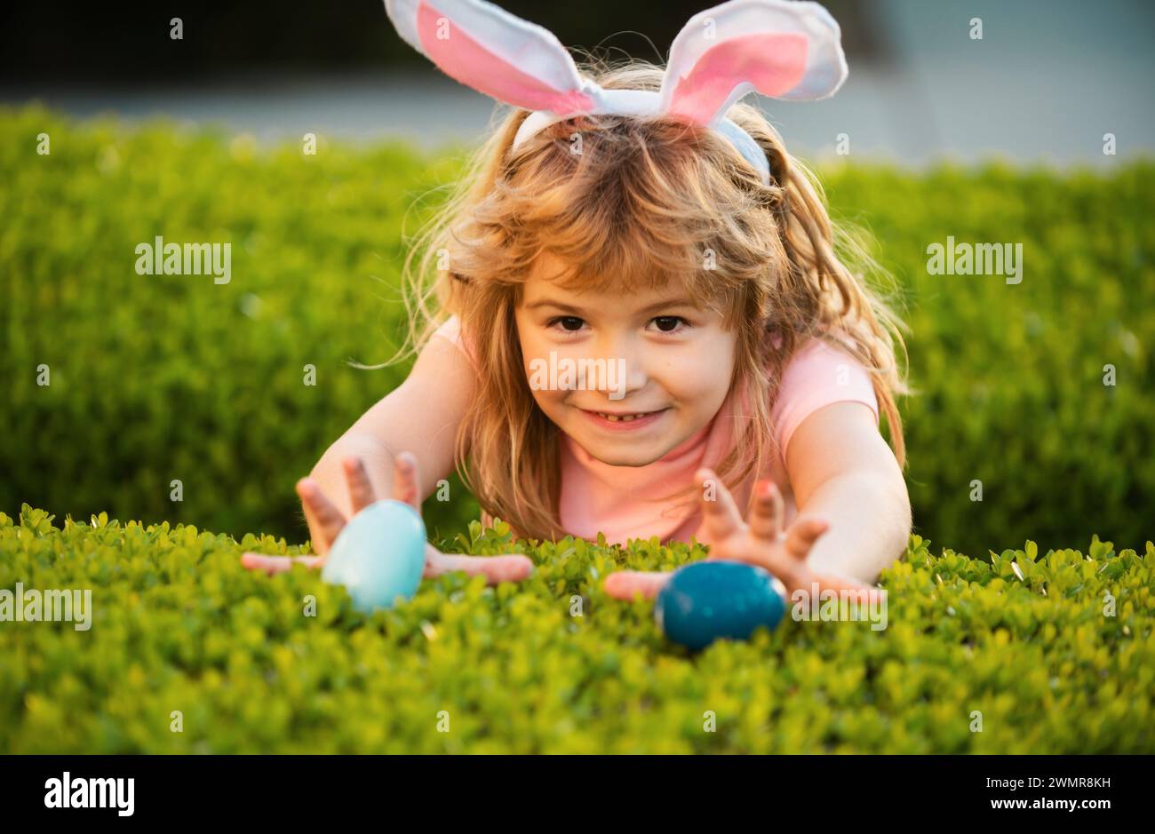 Kids boy hunting easter eggs. Children celebrating easter. Kid in ...