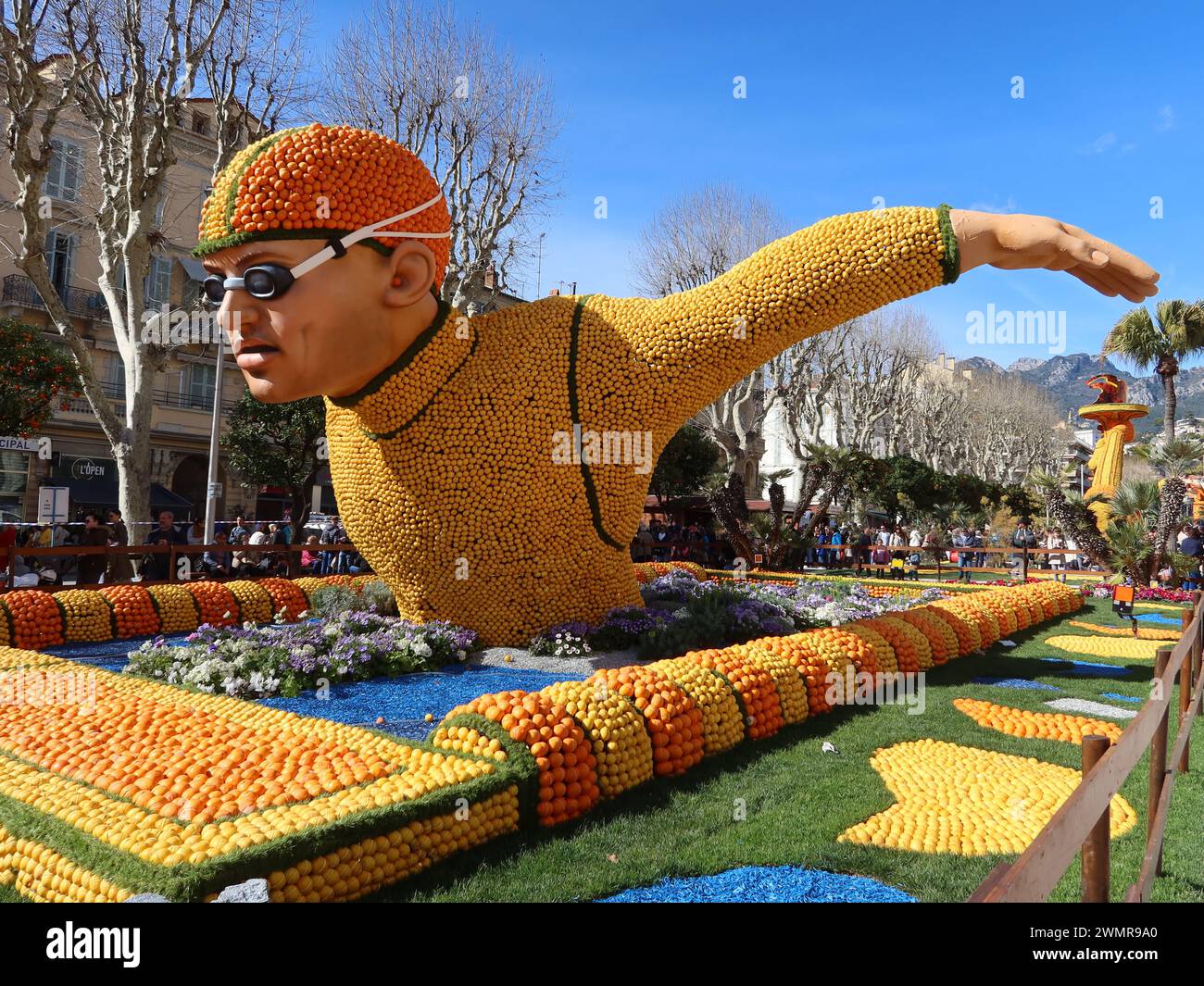 A swimmer is one of the giant Olympic themed citrus sculptures made ...