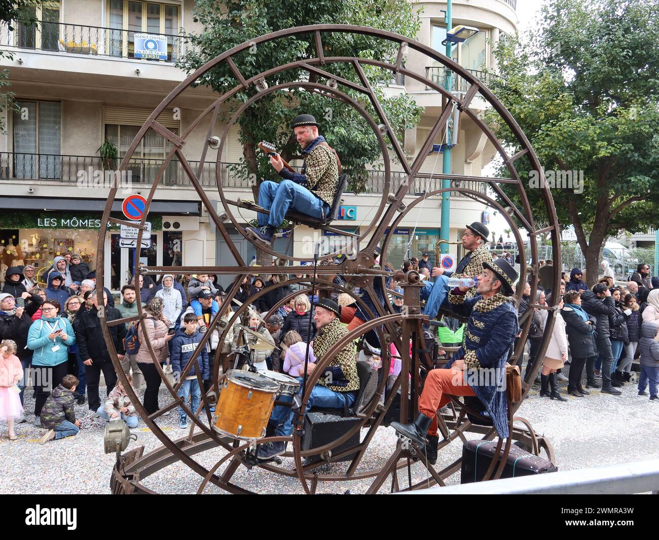 A giant wheel with a band of musicians takes part in the afternoon ...