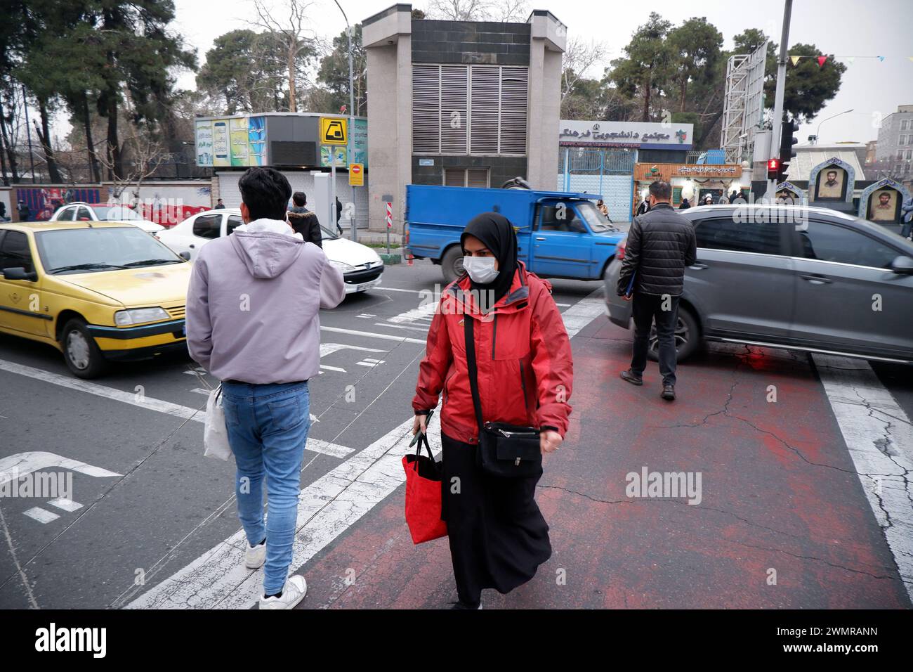 Tehran, Iran. 27th Feb, 2024. An Iranian woman wearing a face mask ...