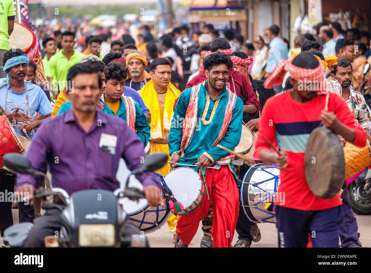 Drummers parade through the streets of Puri in Odisha / Orissa in India ...
