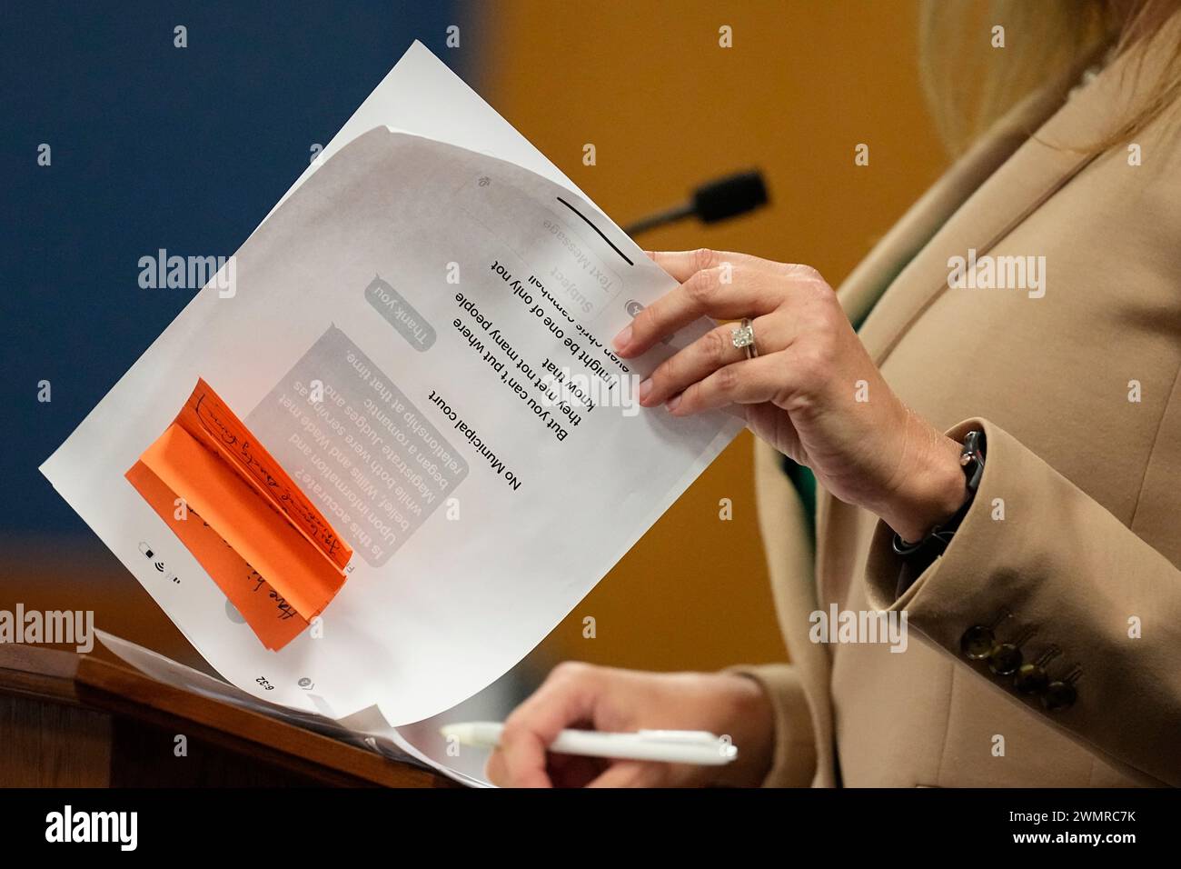 Attorney Ashleigh Merchant looks over documents as she speaks in court ...