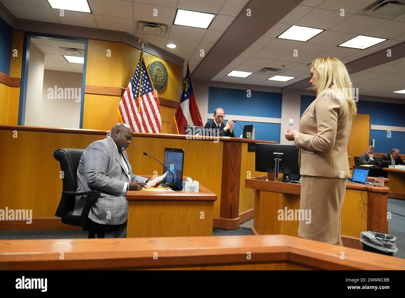 Attorney Ashleigh Merchant speaks with Terrence Bradley in court ...