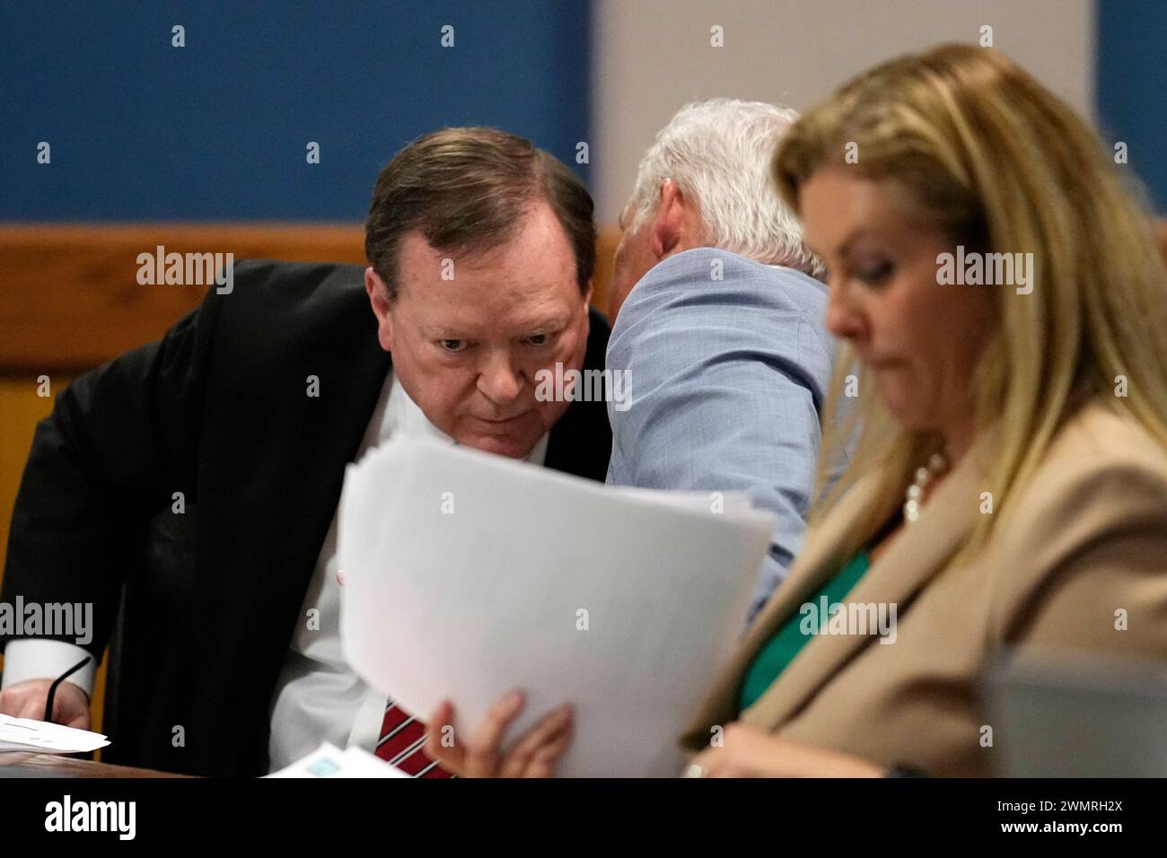 Attorney Craig Gillen, left, and John Merchant confer as attorney ...