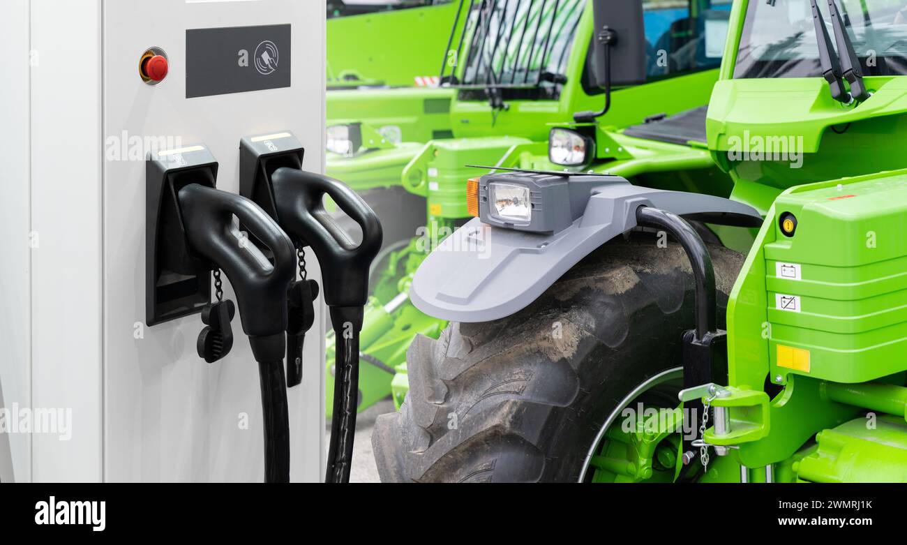 Electric construction machines with charging station. Concept Stock ...