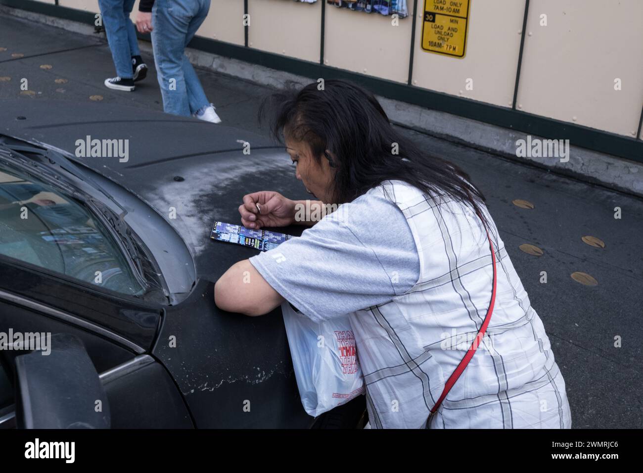 Seattle, USA. 2 Feb, 2024. A person with a Scratch ticket Stock Photo ...