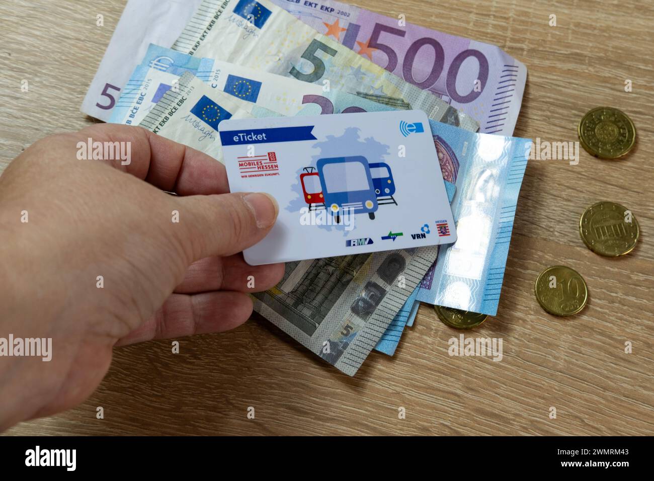 female hand holds electronic eTicket Germany, plastic monthly travel ...