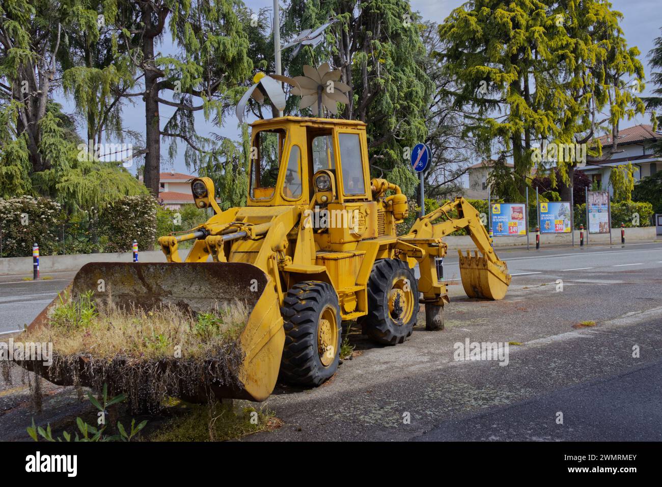An old bulldozer decorated with flowers in the village of Gravellona ...