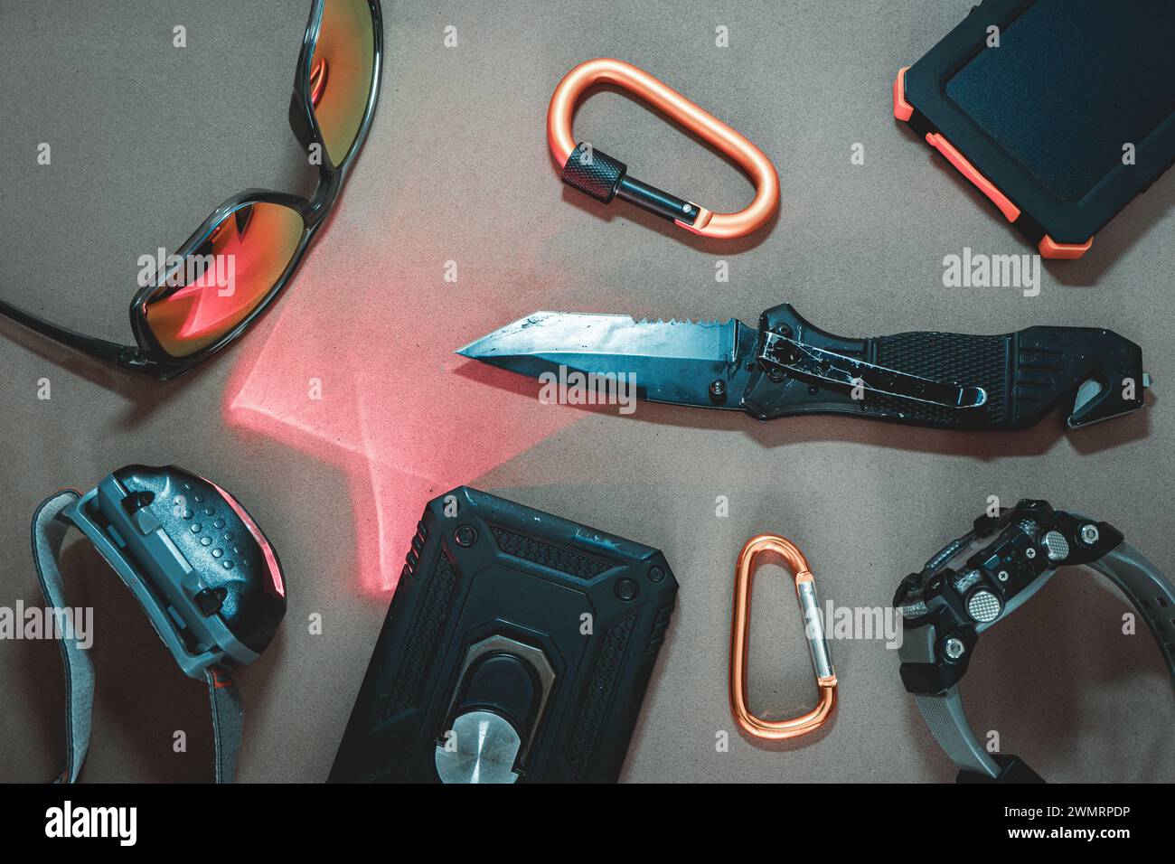 Flat lay of some Outdoor/EDC gear on a brown background Stock Photo - Alamy