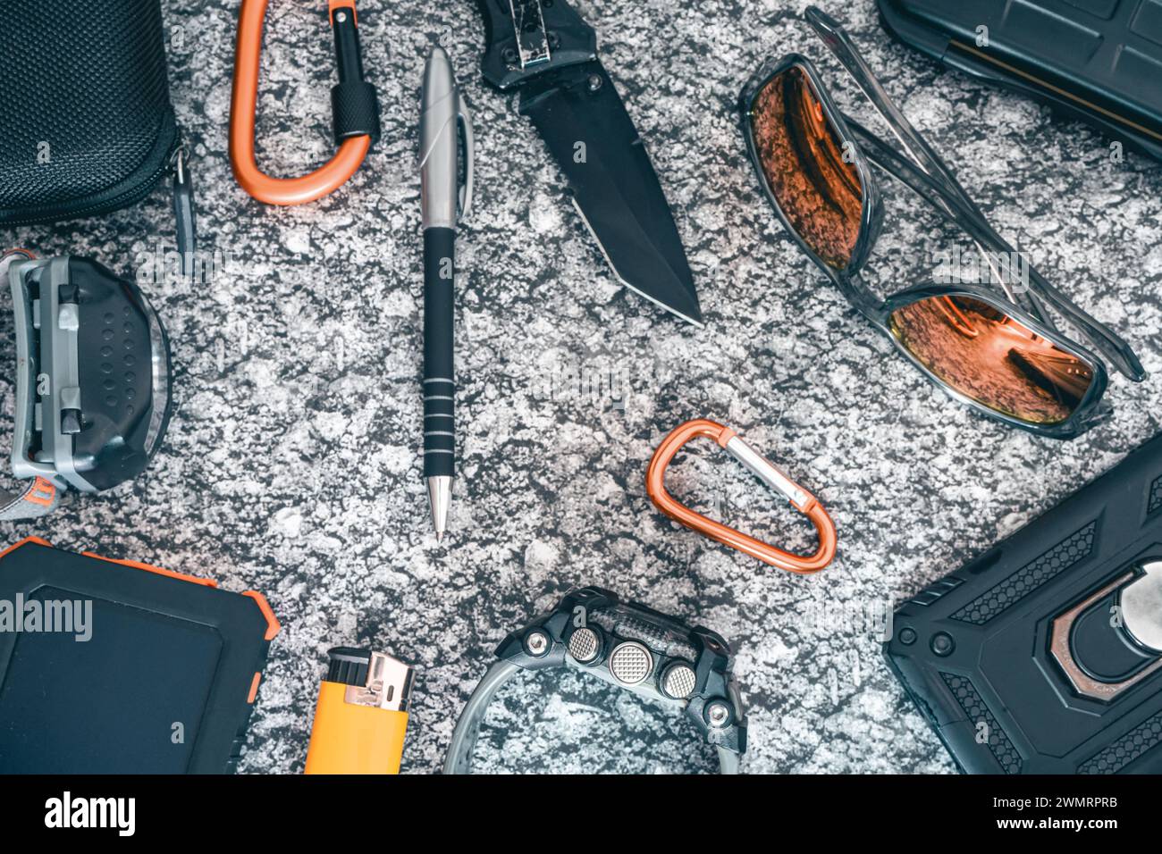 Flat lay of some Outdoor/EDC gear on a grey background Stock Photo - Alamy